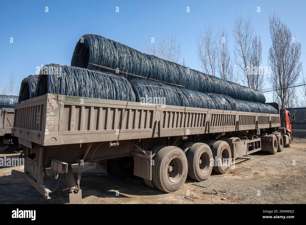Bundles of steel bars piled up on the car Stock Photo - Alamy