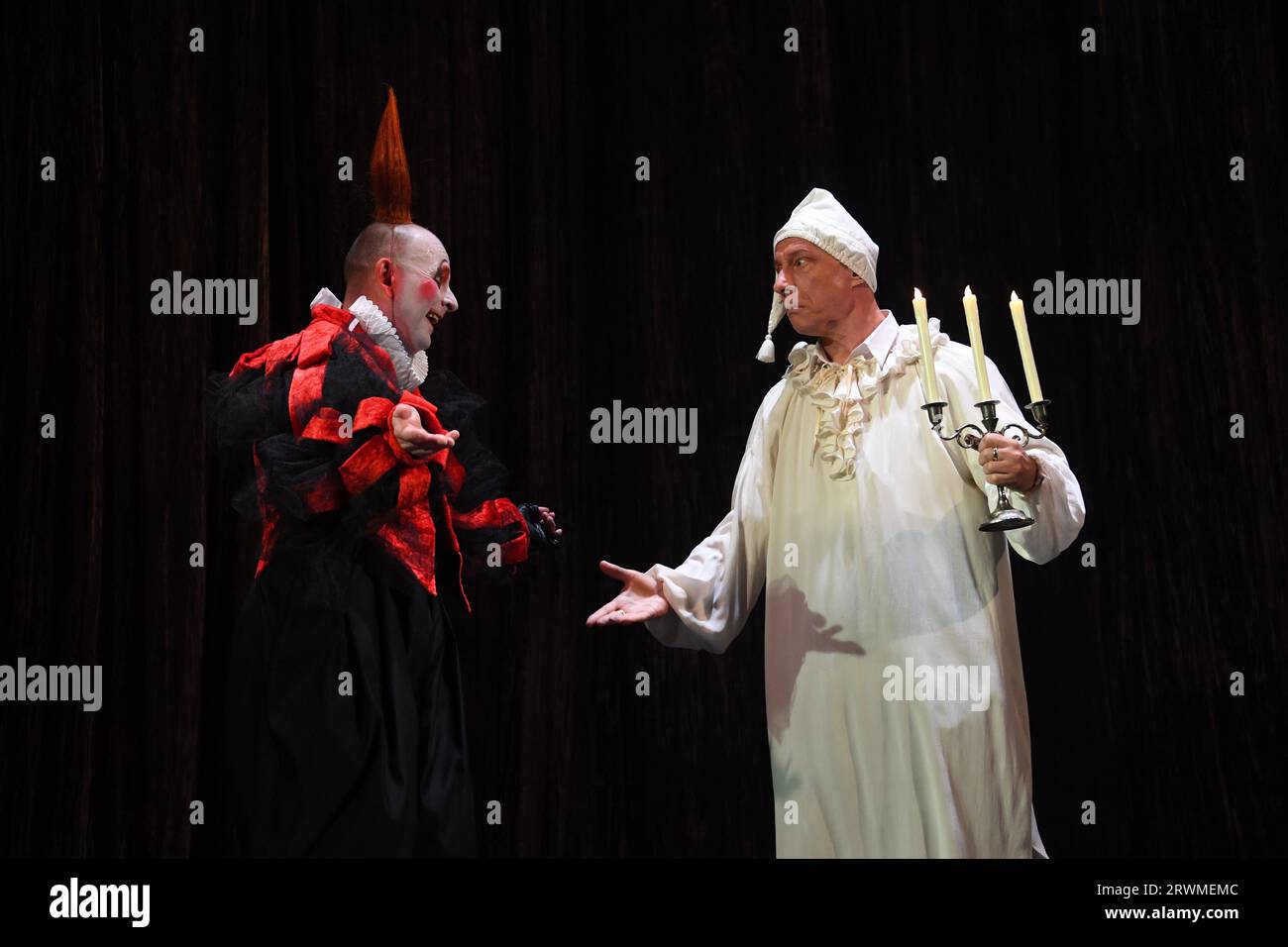 Moscow. Actors Andrei Smirnov as a jester and Andrei Mezhulis as a ...