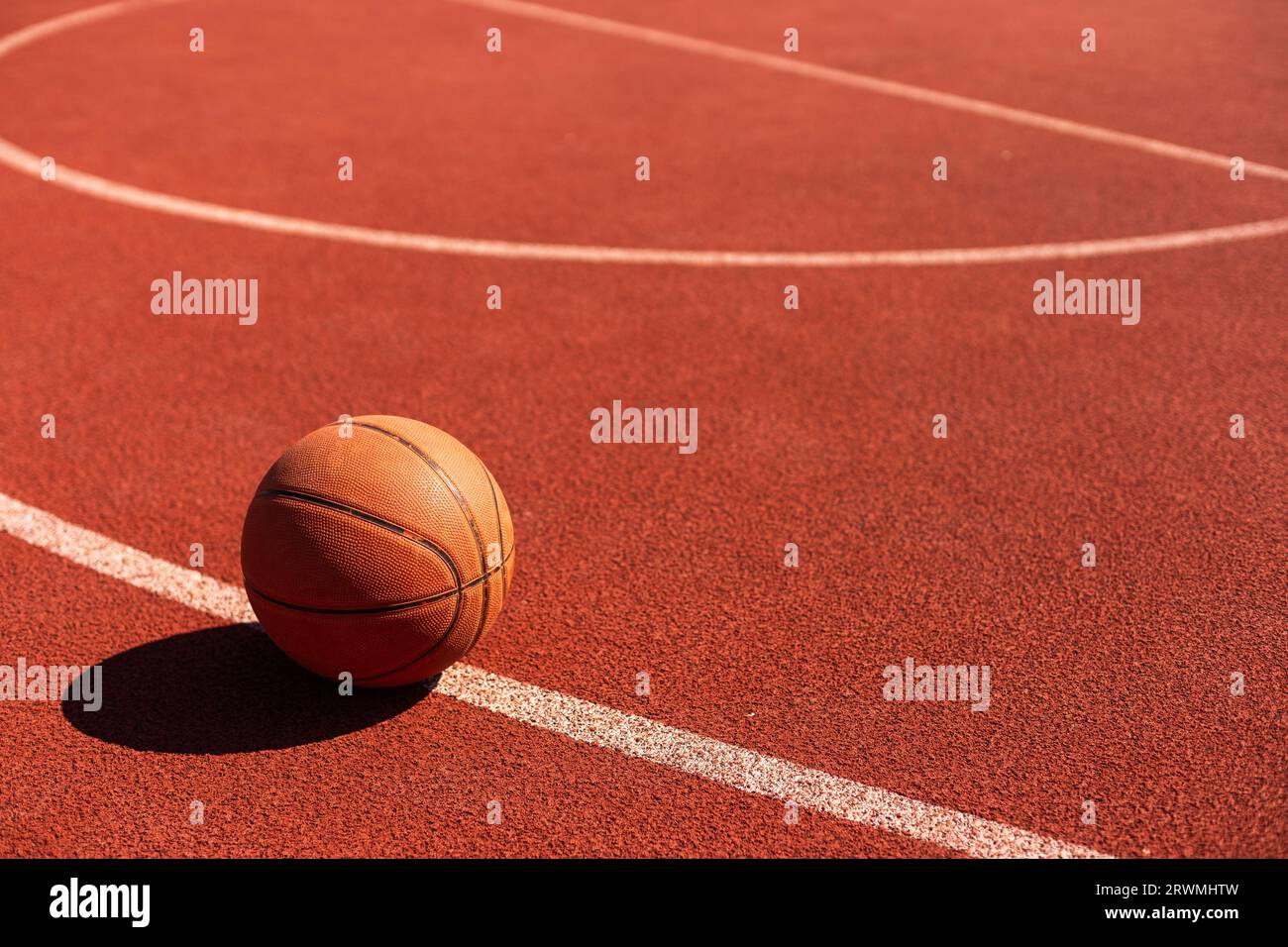 Orange basketball on court of gymnasium sport floor. Team sport concept ...