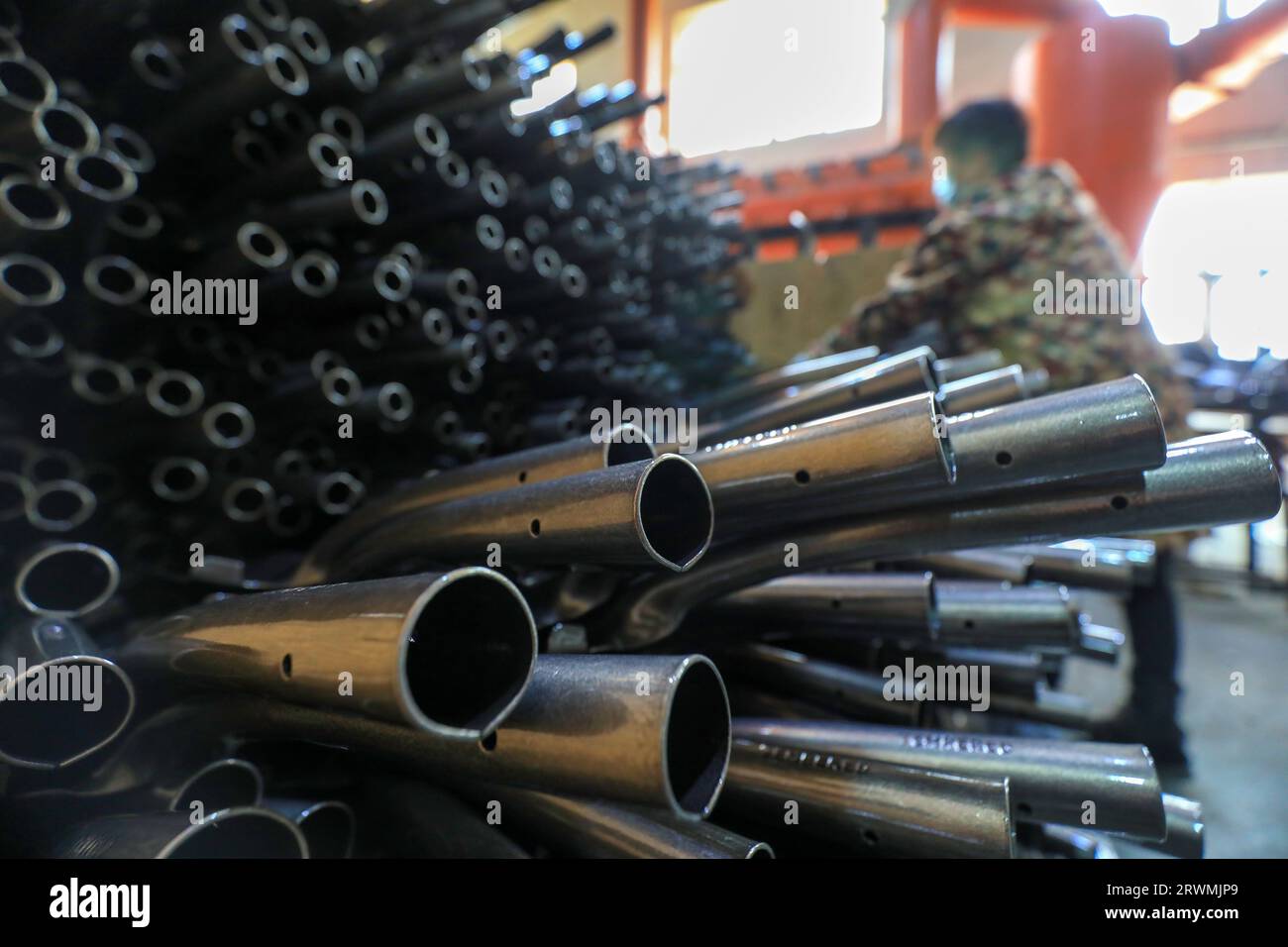 workers work hard on the steel shovel production line in a hardware ...