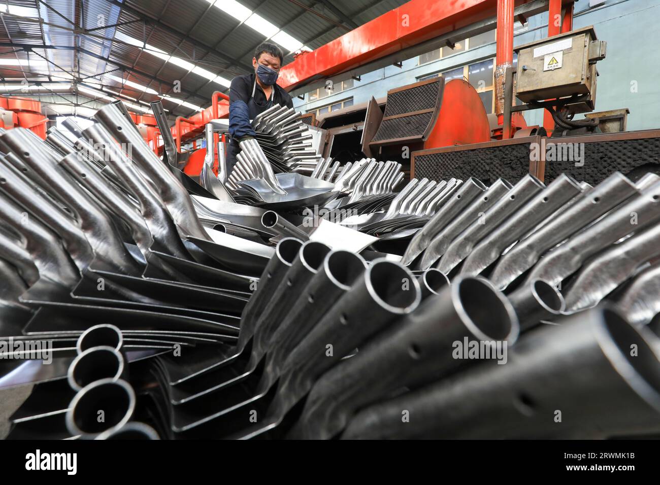LUANNAN COUNTY, China - April 5, 2022: workers work hard on the steel ...