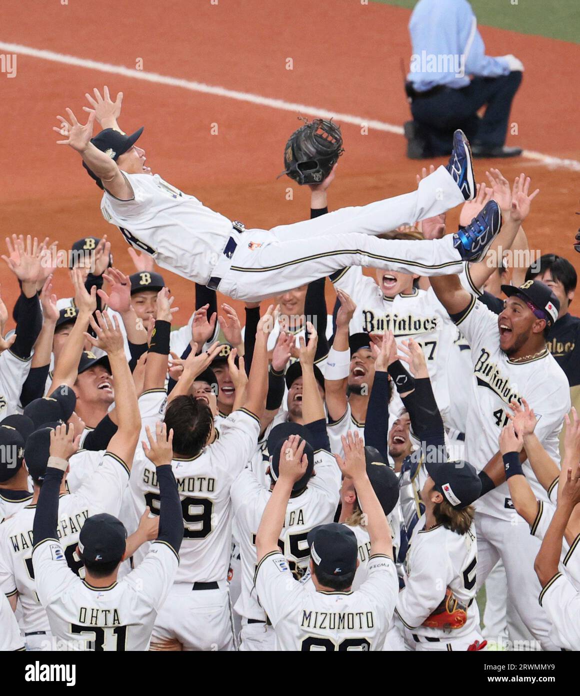 Satoshi Nakajima, manager of the Orix Buffaloes is lifted up after winning the Pacific League at ...