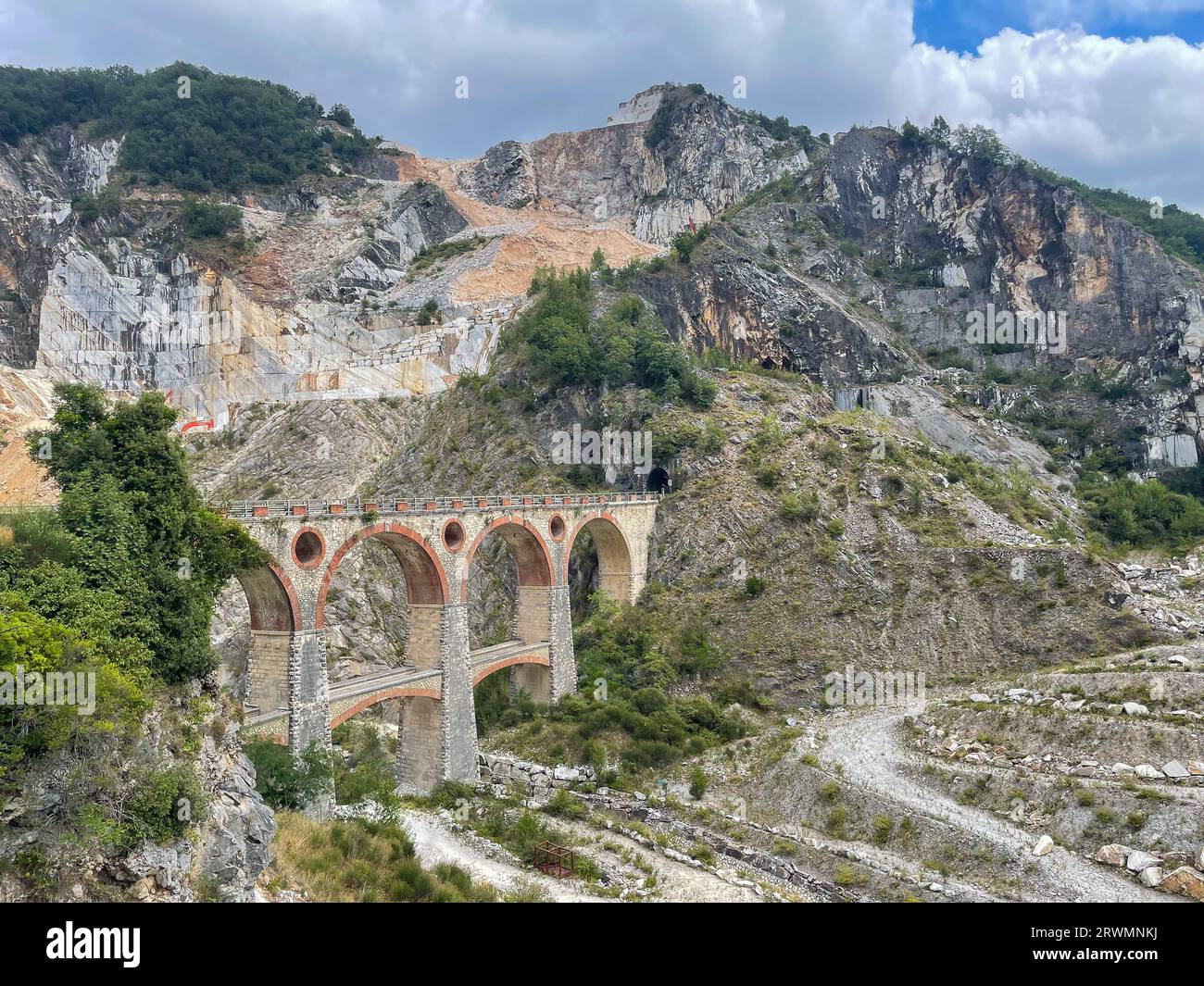 bridge over the river in the carrara marble mountains in italy Stock ...
