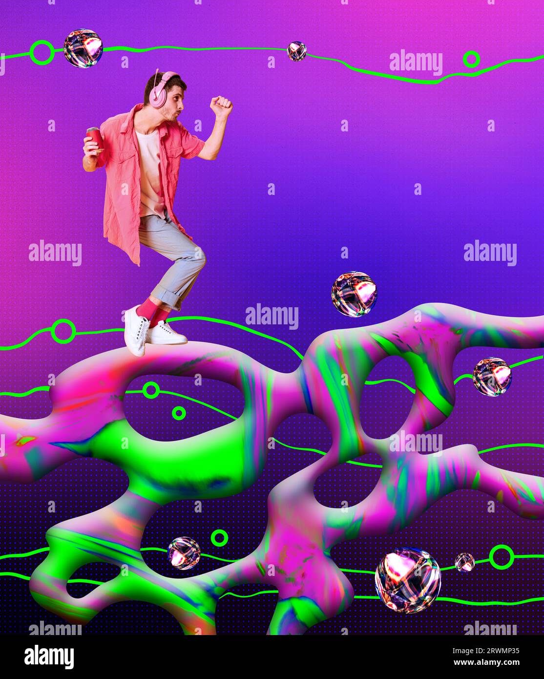 Young guy in casual clothes listening to music and dancing over ...