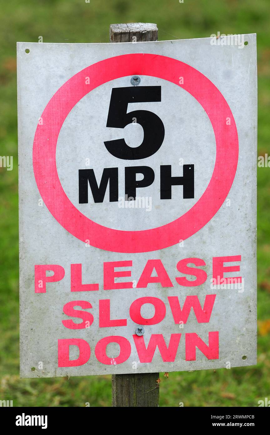 Five miles per hour sign in school car park Stock Photo - Alamy