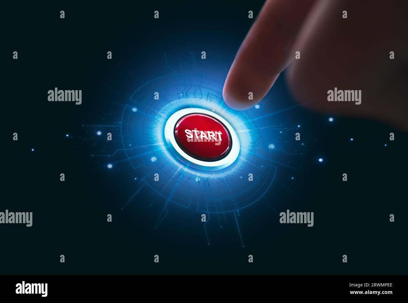 Finger pressing red start button on dark background, Hand push a start ...