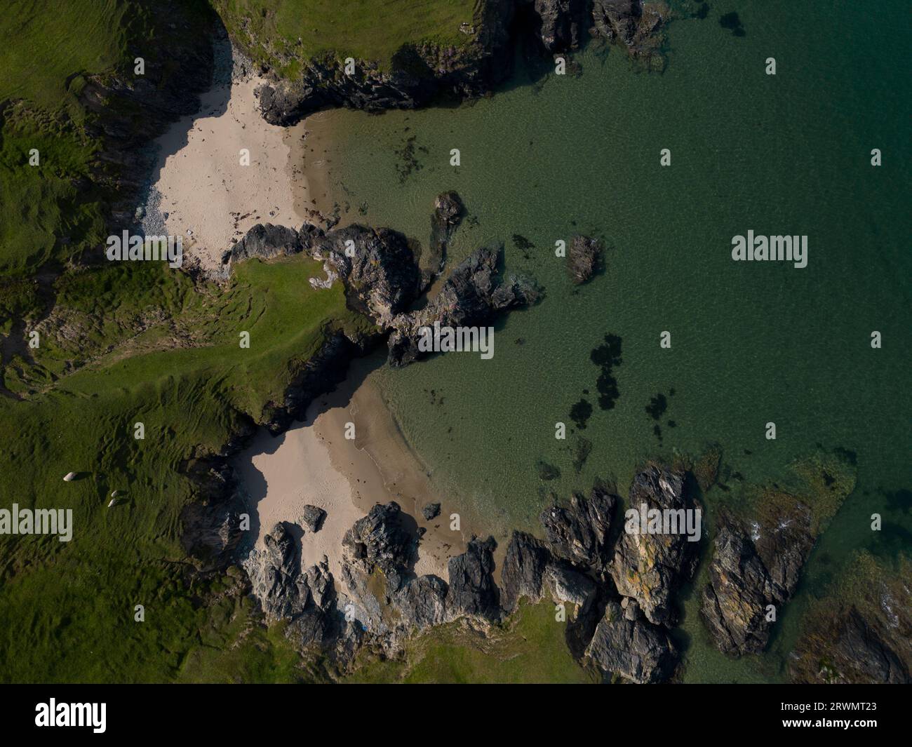 An early morning drone shot of Porth Towyn beach on the welsh coastal ...