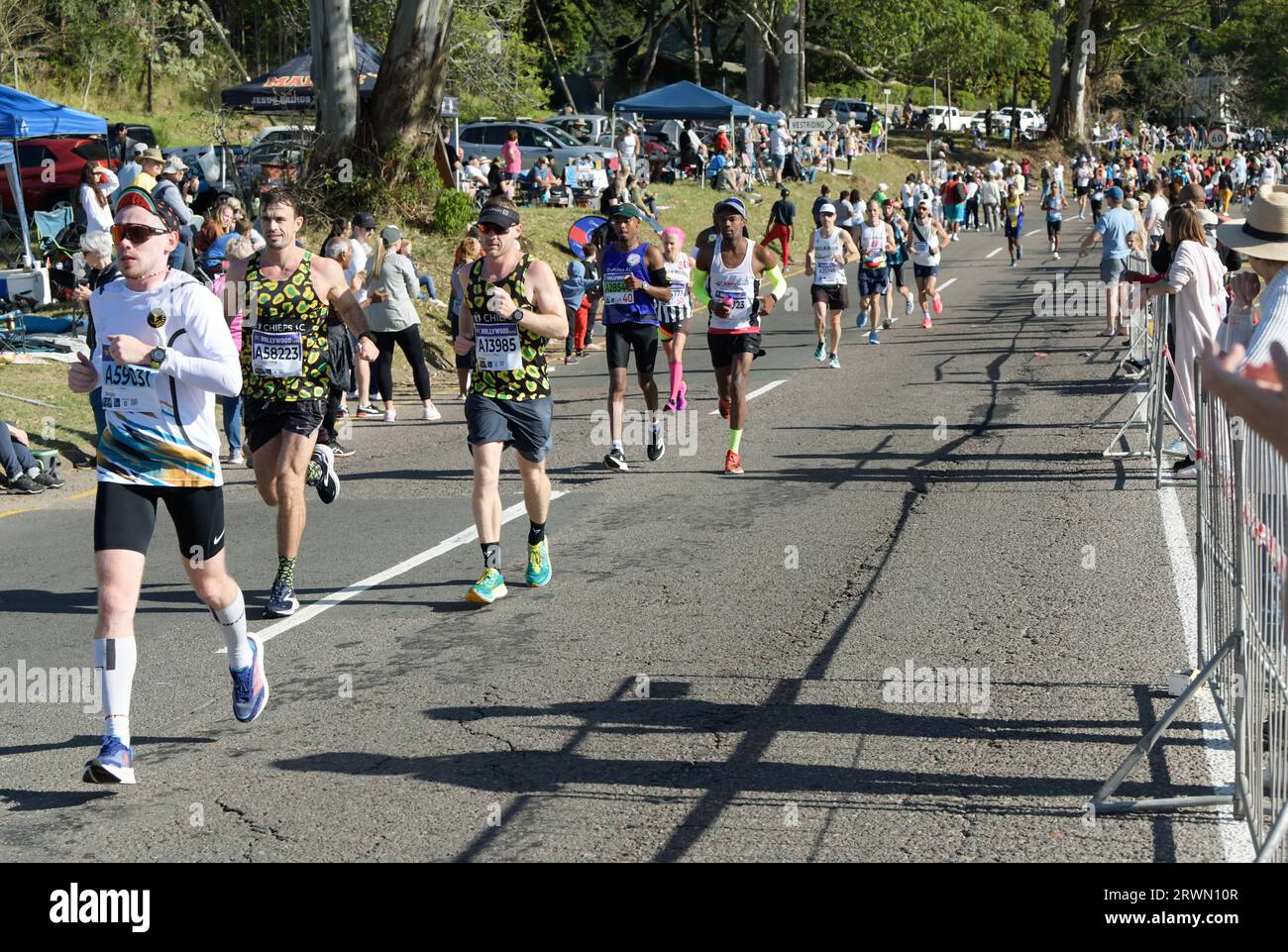 People running in road racing event, 96th Comrades Marathon 2023 ...