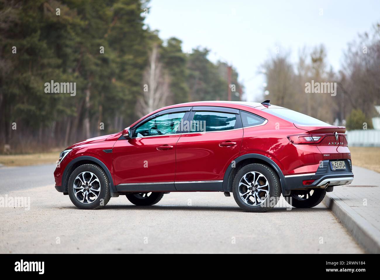 Berlin - March 2022: 2021 Renault Arkana e-Tech hybrid SUV car three ...