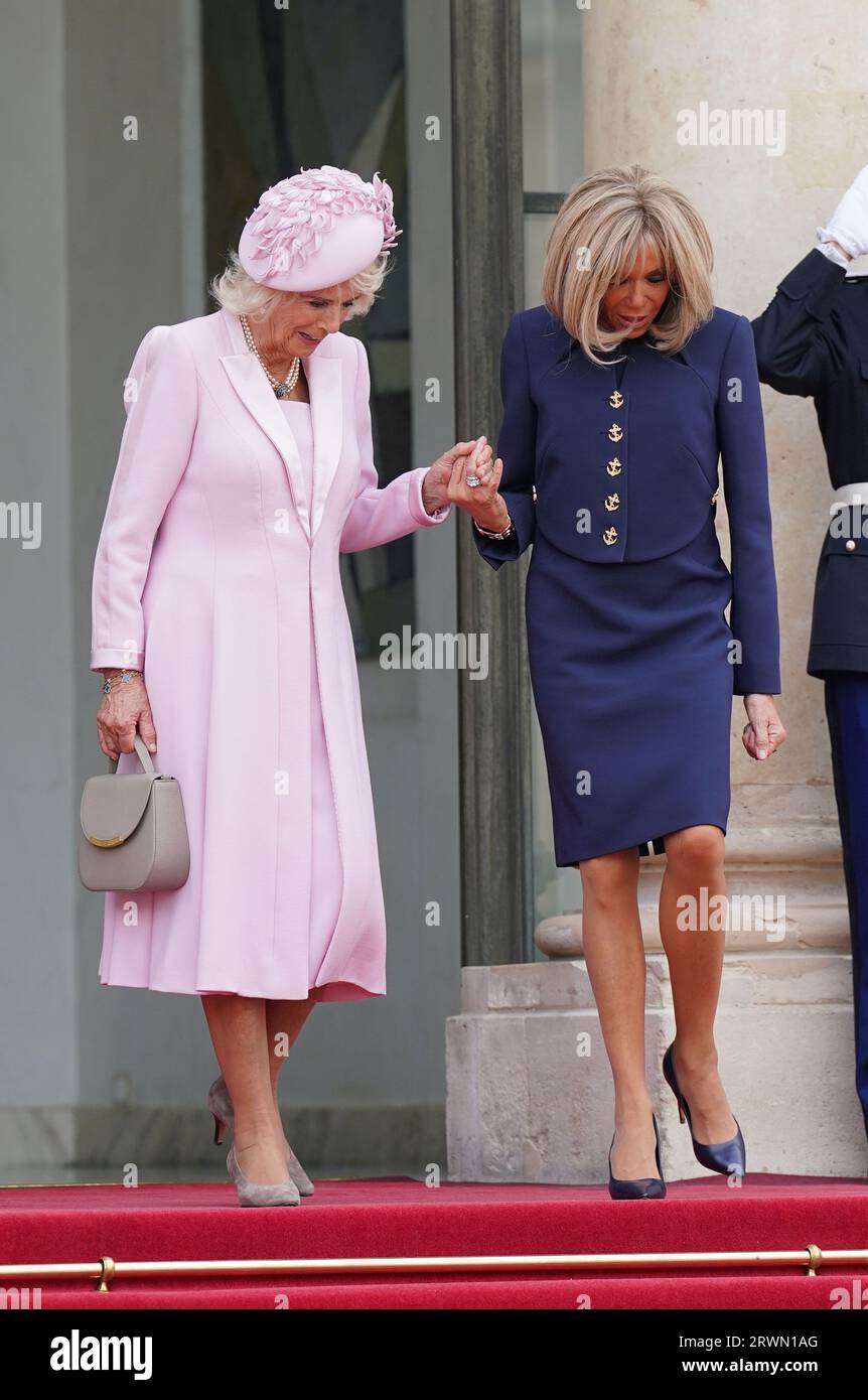 Brigitte Macron with Queen Camilla (left) as she leaves the Elysee ...