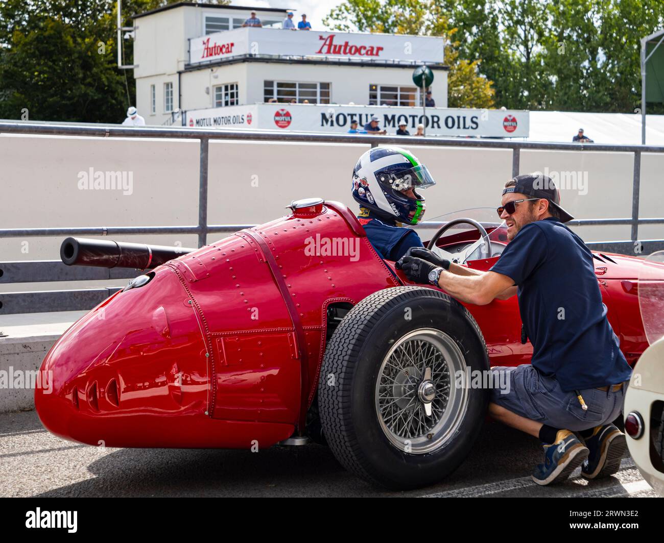 racing driver Marino Franchitti in a red Maserati 250F on a testing day ...