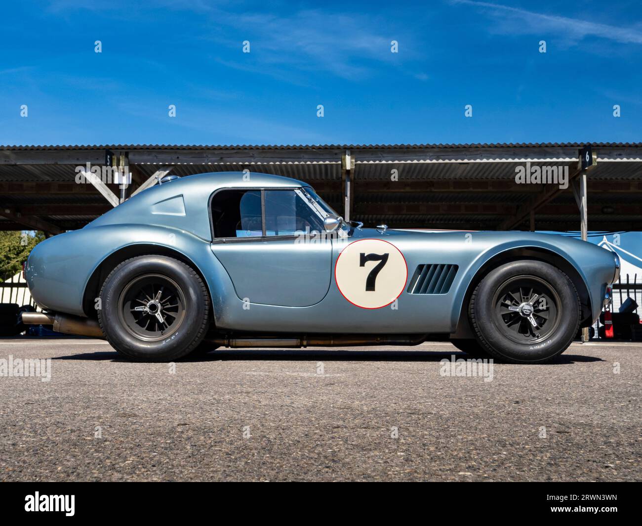An AC Cobra racing car in the paddock testing at Goodwood motor racing ...