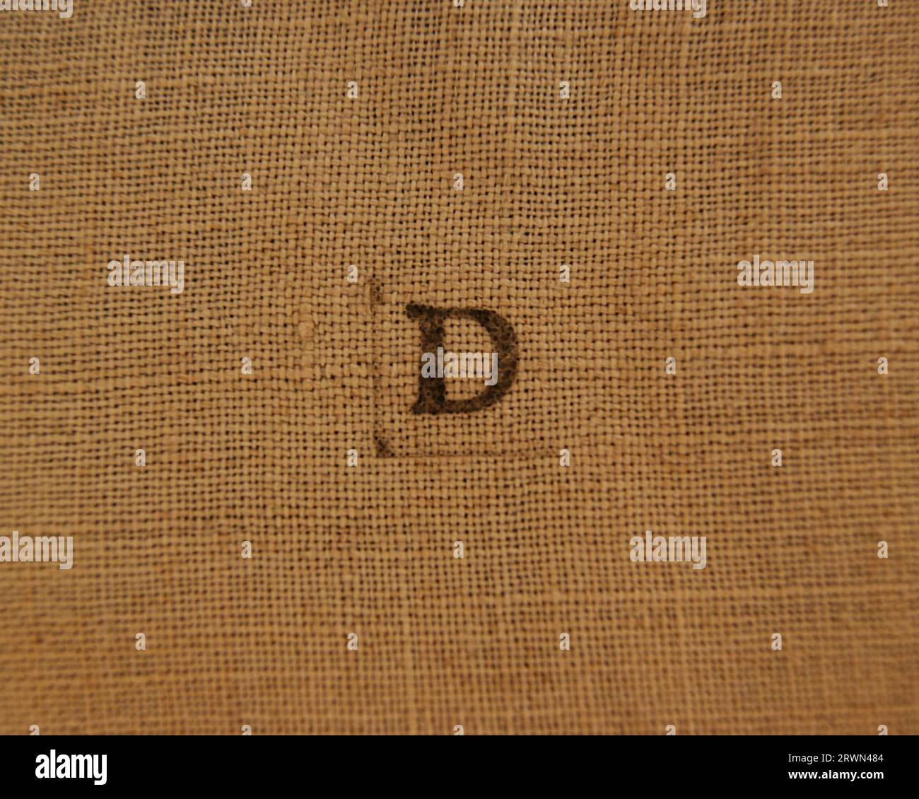 Letter D. Stamp letters on linen fabric Stock Photo - Alamy