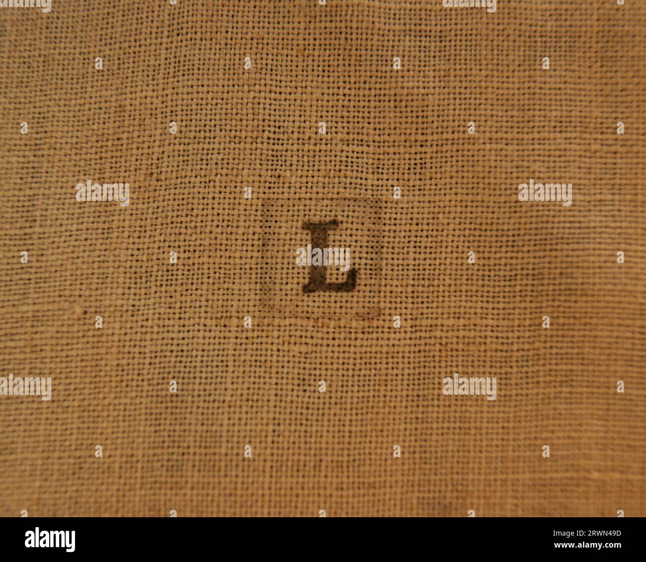 Letter L. Stamp letters on linen fabric Stock Photo - Alamy