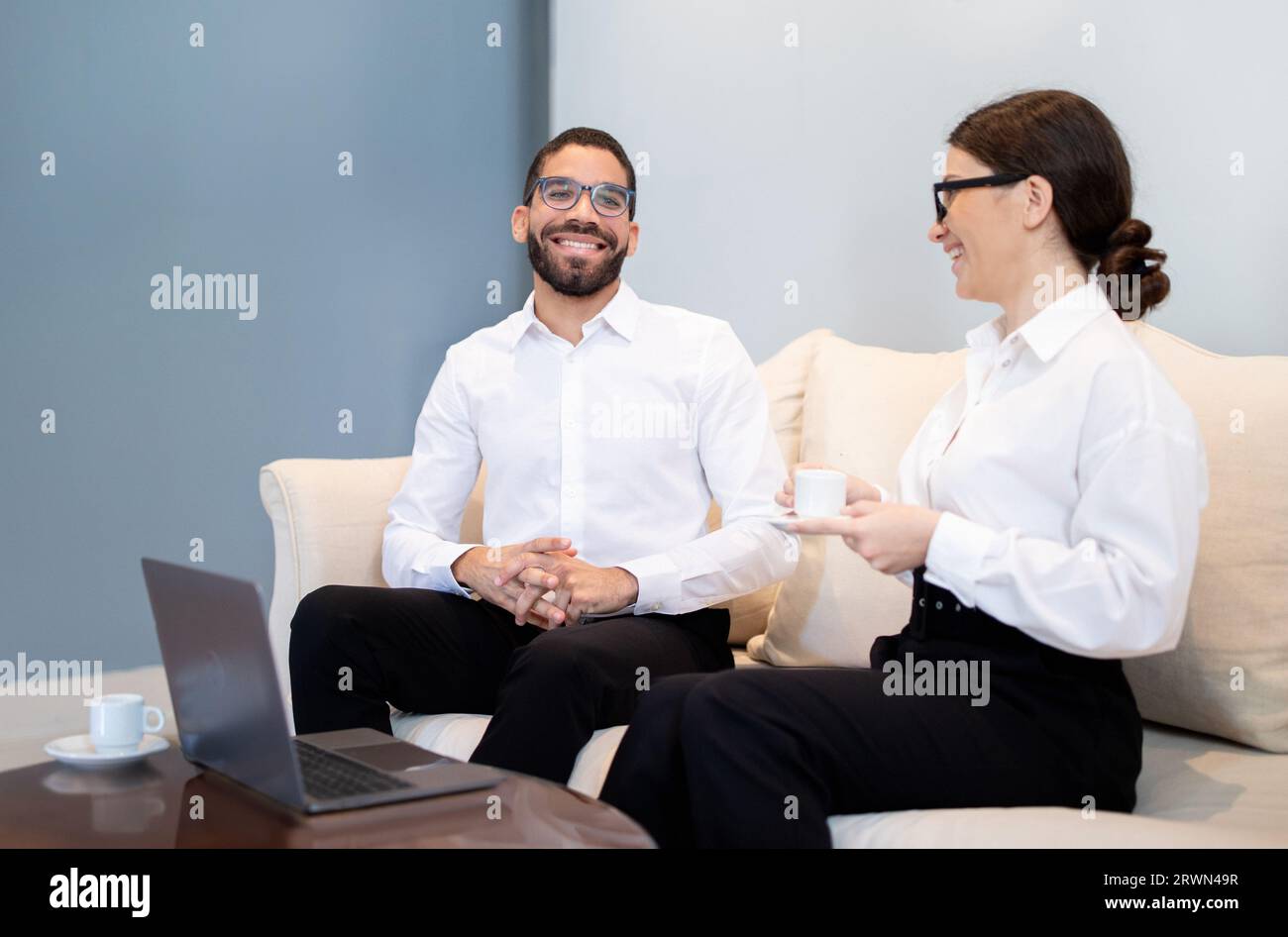 Smiling Businesswoman Conducting Job Interview with New Employee Man Indoor Stock Photo - Alamy