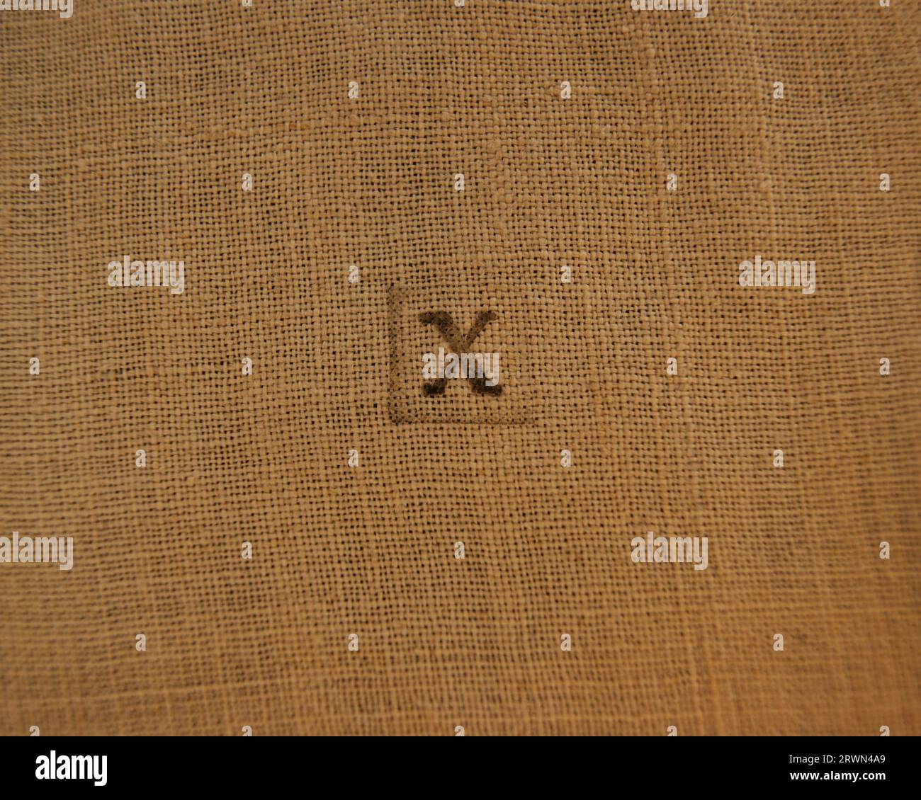 Letter X. Stamp letters on linen fabric Stock Photo - Alamy