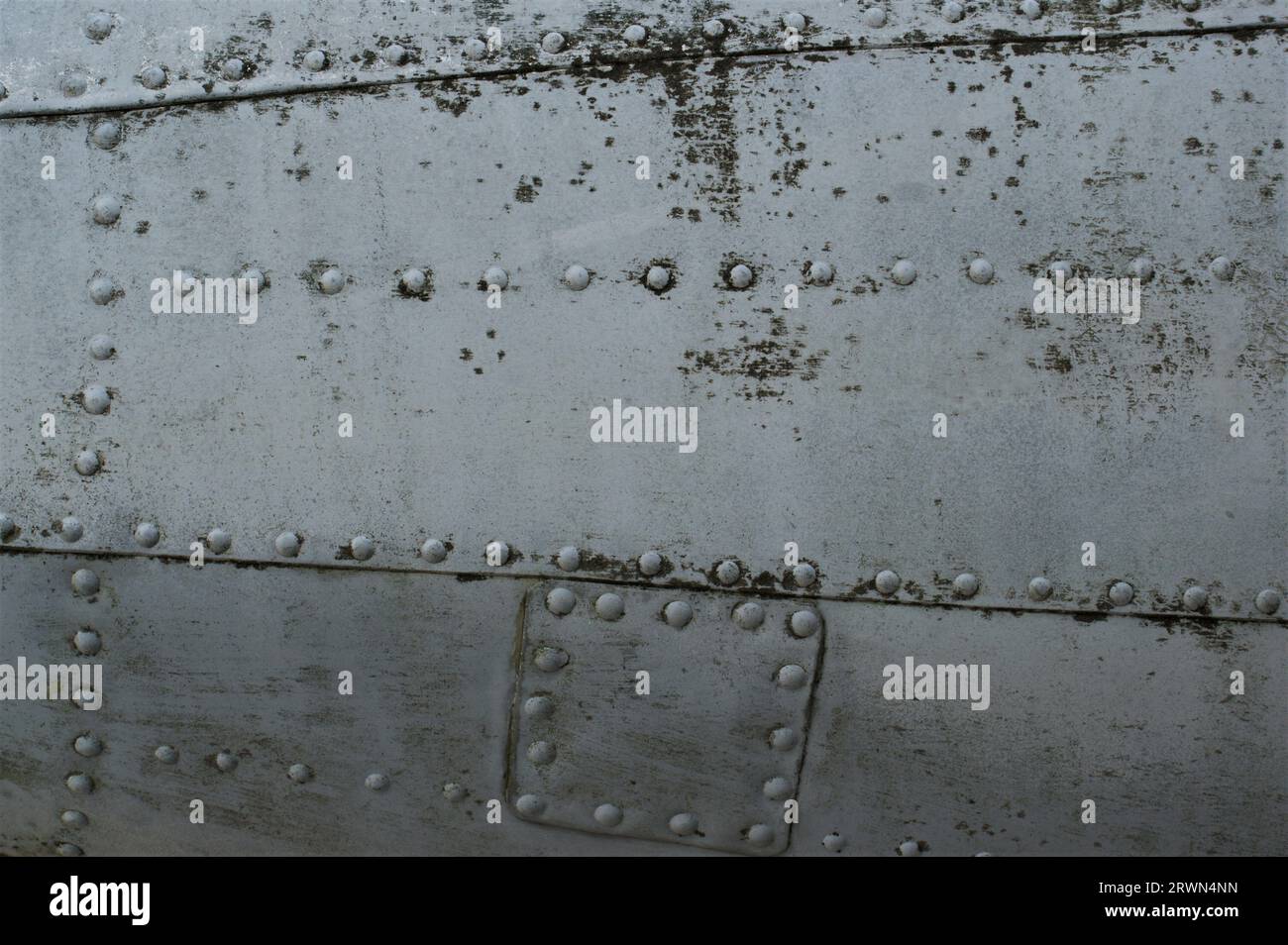 Riveted fuselage of an old airplane. Antique metallic background Stock ...