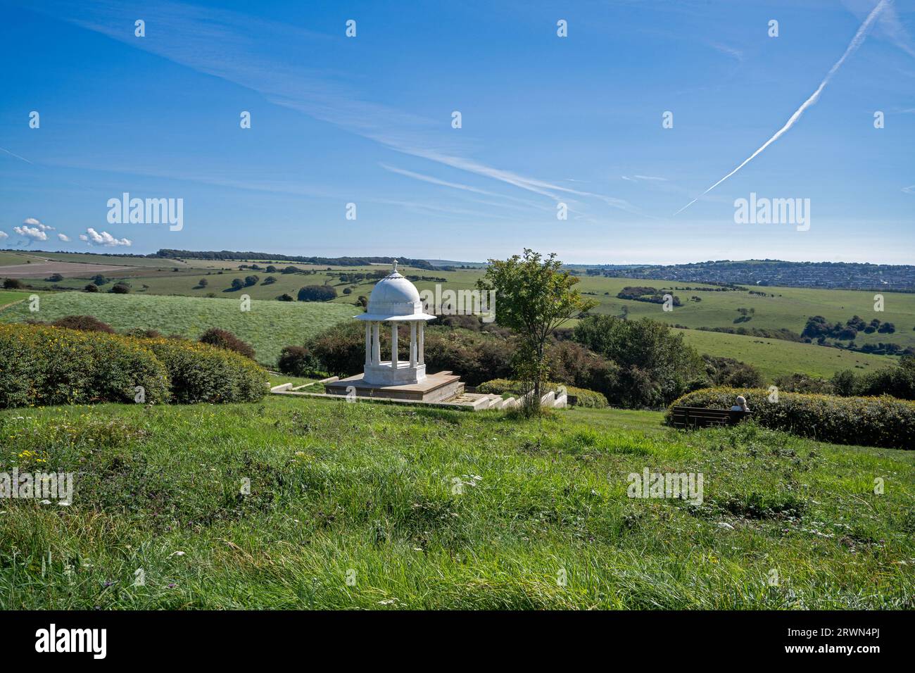 A lady enjoying the view from The Chattri on The South Downs at Patcham ...