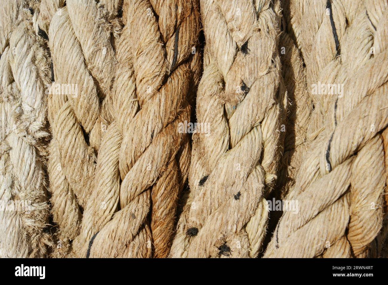 old braided rope used to tie and tow boats, cars and other heavy ...