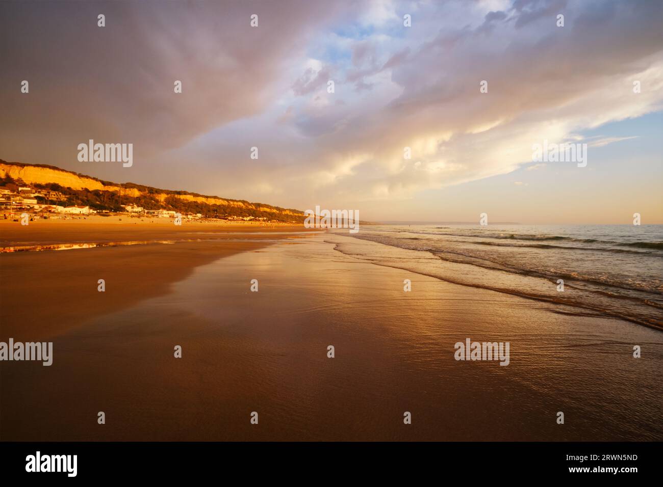 Atlantic ocean sunset with surging waves at Fonte da Telha beach ...