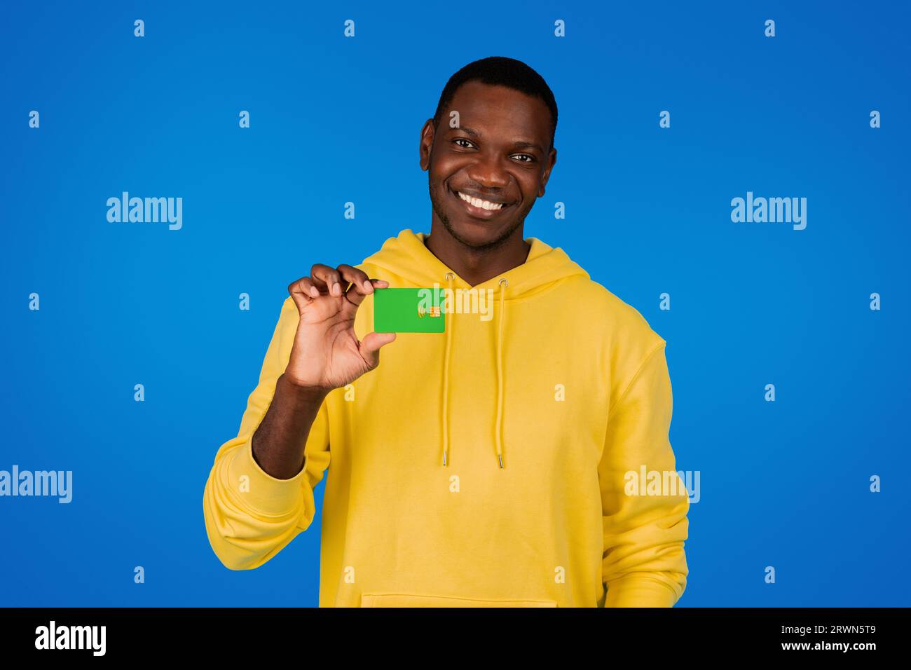 Happy handsome young black guy shows credit card, recommends finance ...