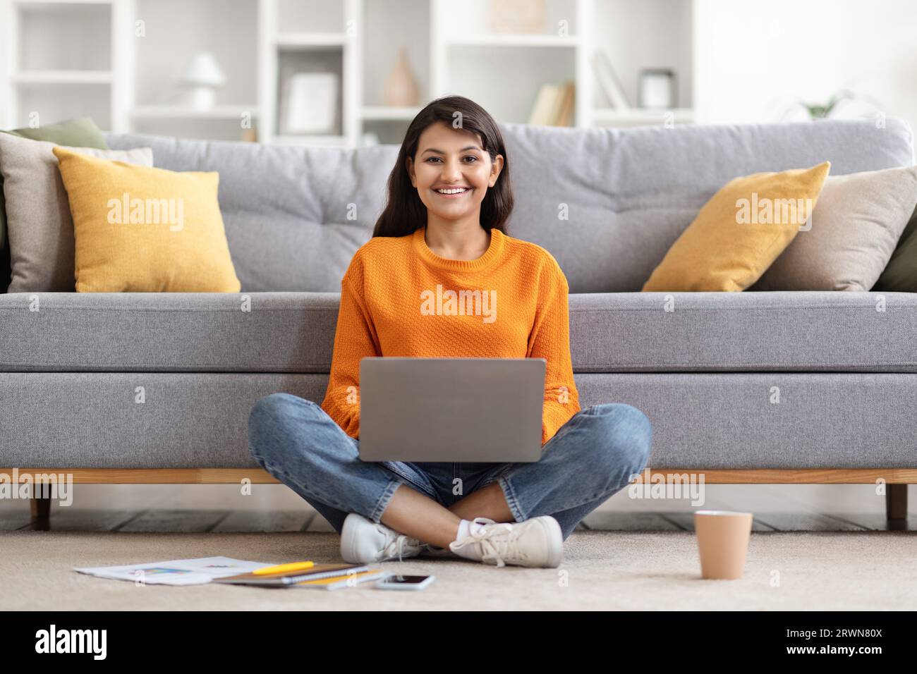 Positive millennial indian woman using computer notebook at home Stock ...