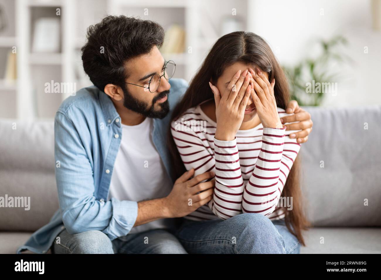 Young man comforting crying girlfriend hi-res stock photography and ...