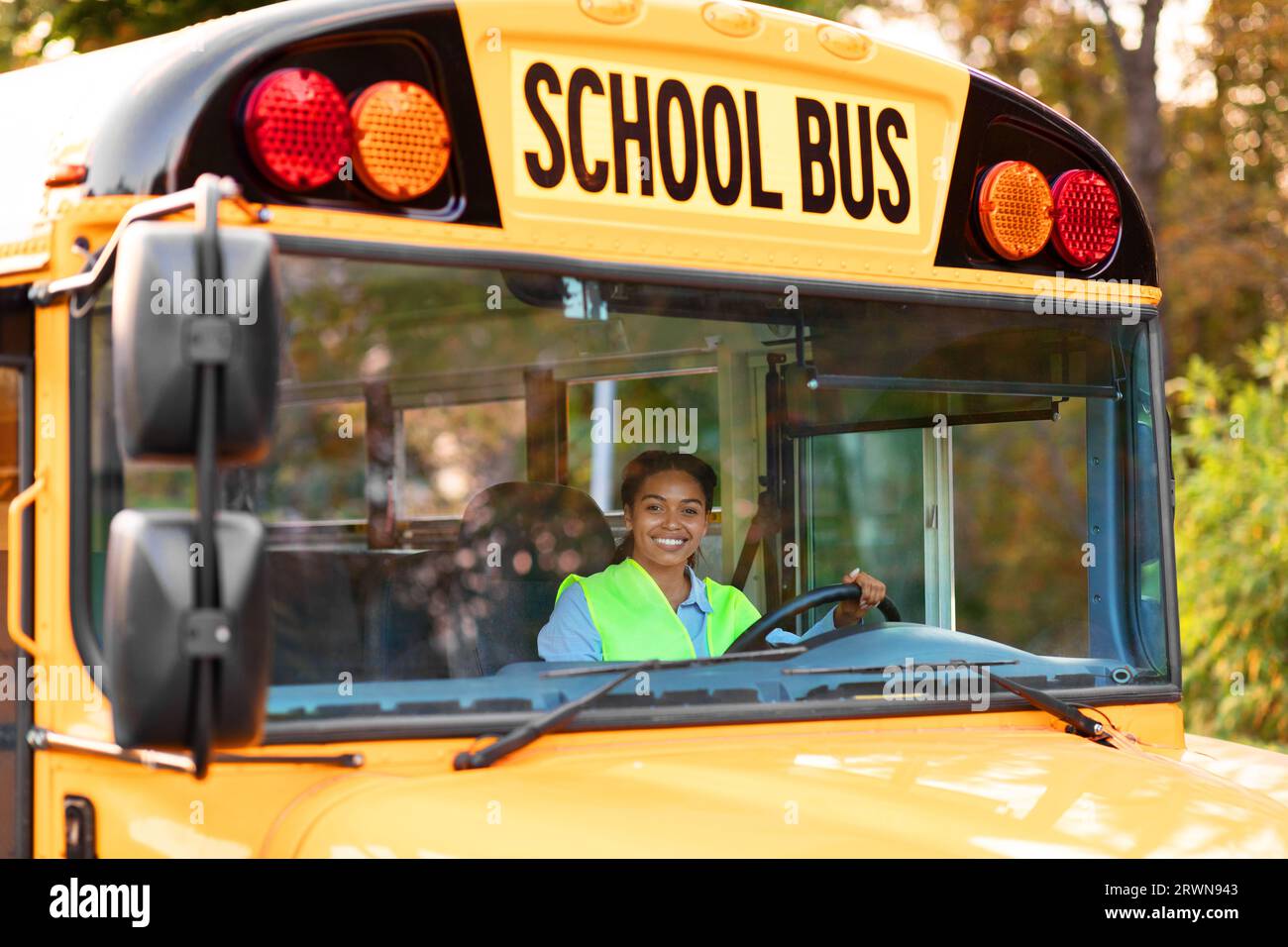 Portrait Of Happy Black Female Driver Driving Yellow School Bus Stock ...