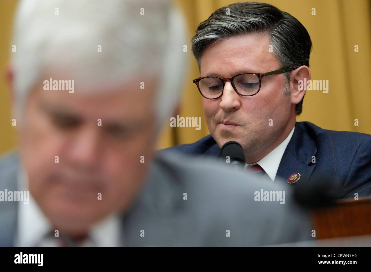 Rep. Mike Johnson, R-La., listens as Attorney General Merrick Garland ...