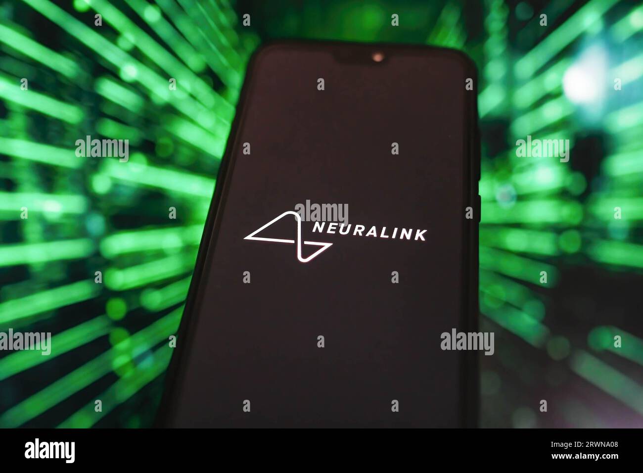 In this photo illustration a Neuralink logo is displayed on a ...