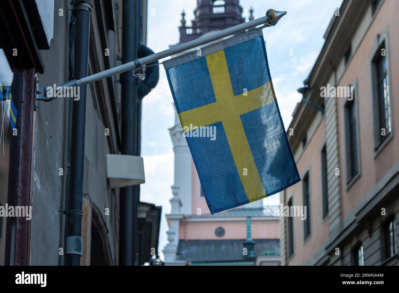 Sweden national flag waving on a Stockholm city building facade, close ...