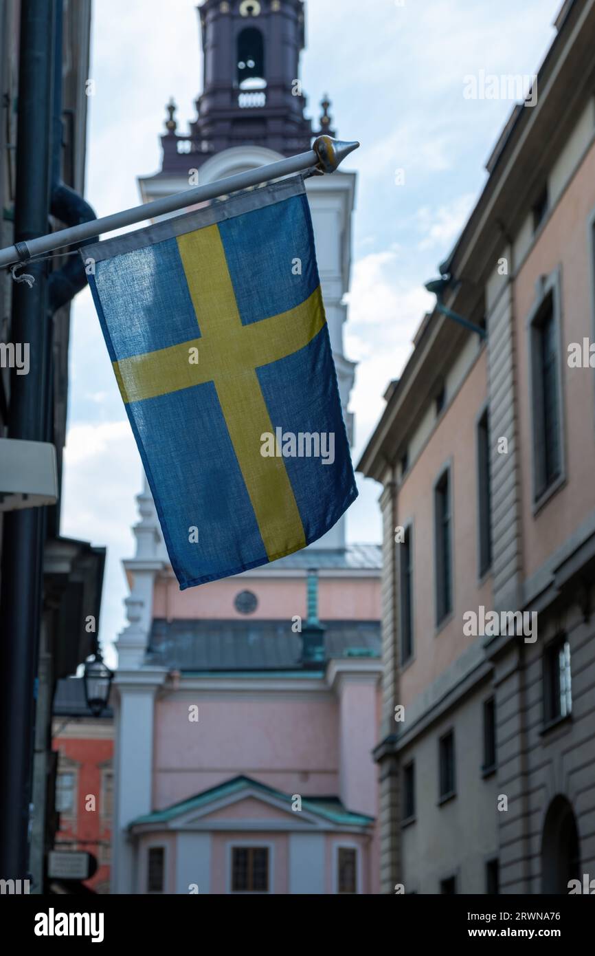 Sweden national flag waving on a Stockholm city building facade, close ...