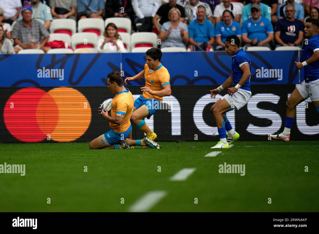Uruguay's Nicolas Freitas, left, catches the ball during the Rugby ...
