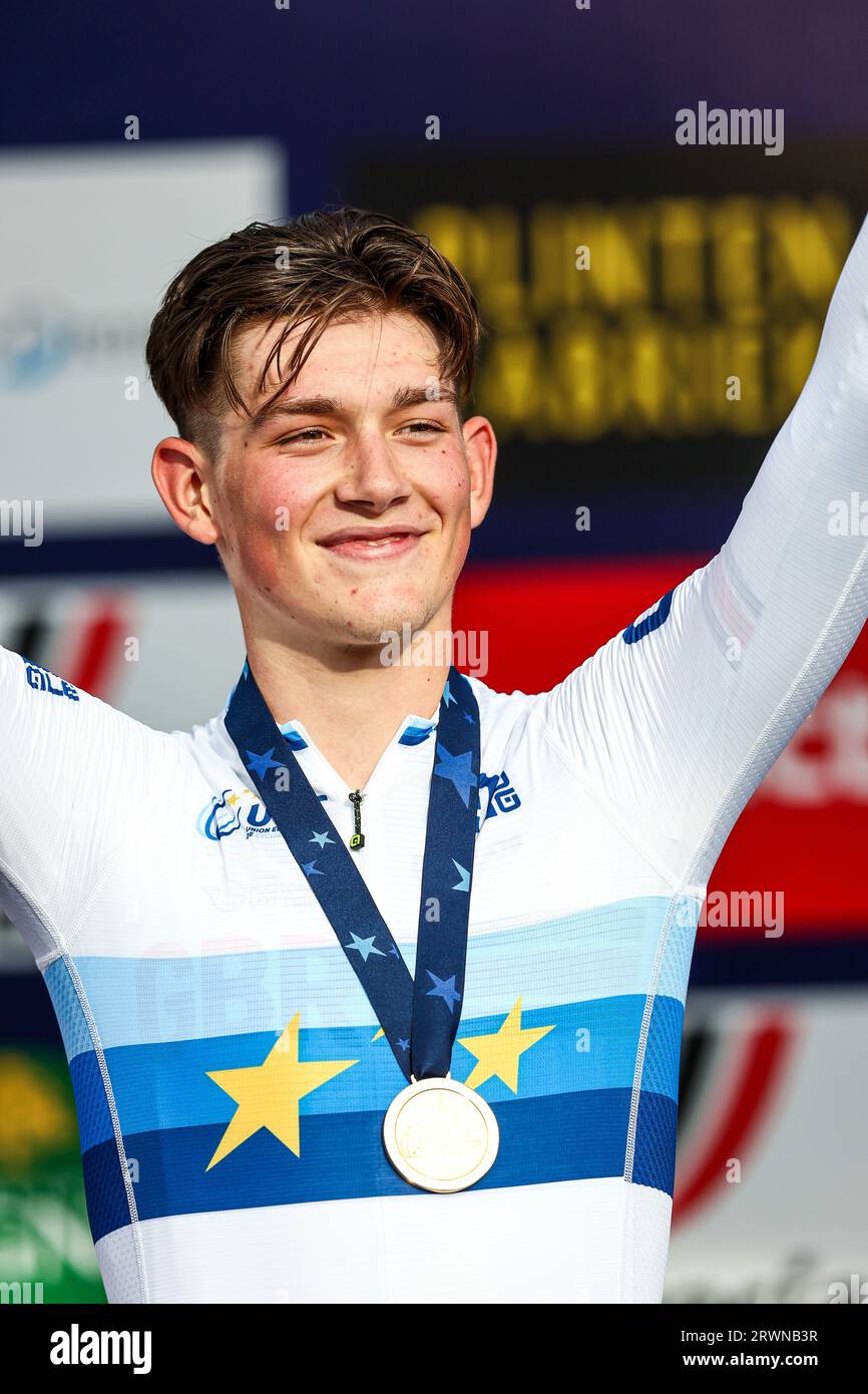 EMMEN - Winner Joshua Tarling on the podium after the individual time ...