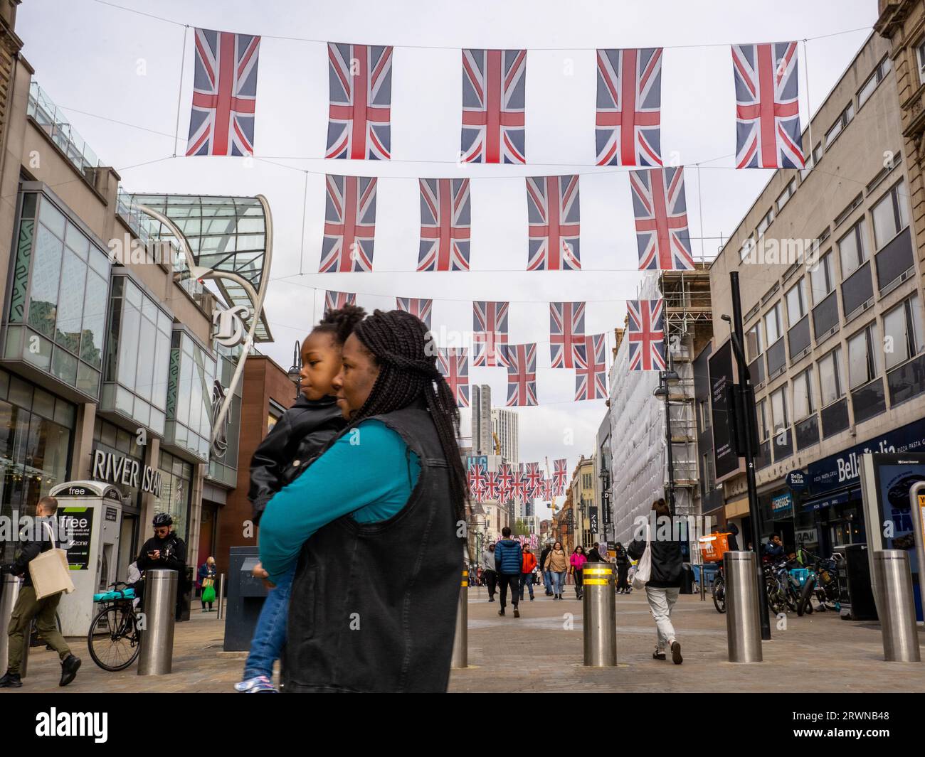 The Union flag of great Britain flies over Briggate high street in ...