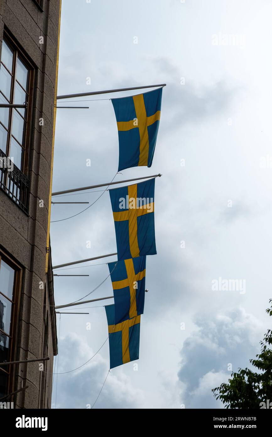 Sweden national flags waving on a Stockholm city building facade ...