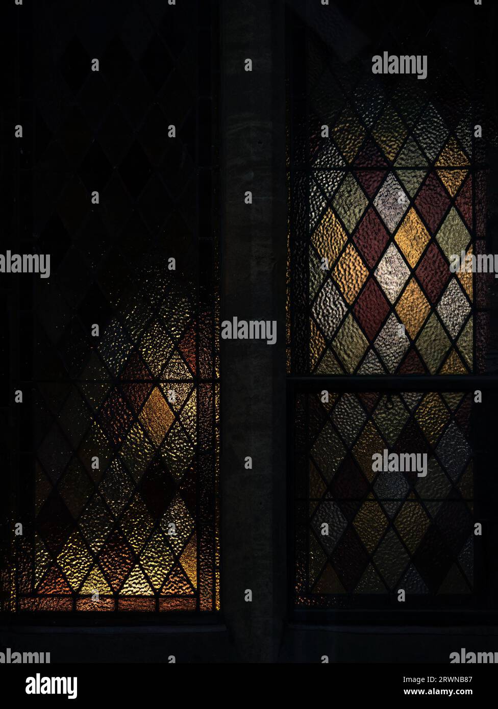 Church stained glass window, illuminated from inside, viewed from ...