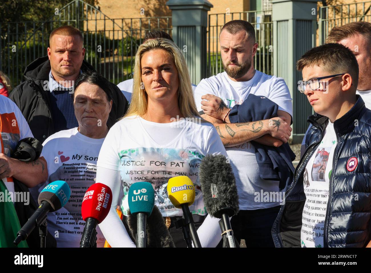 Ellen Ward (centre), widow of Patrick Ward, speaks to the media outside ...