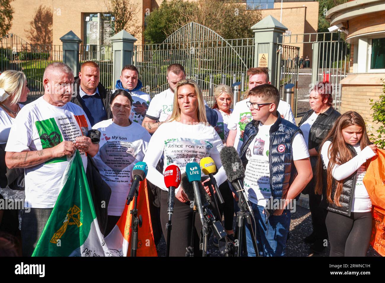 Ellen Ward (centre), widow of Patrick Ward, speaks to the media outside ...