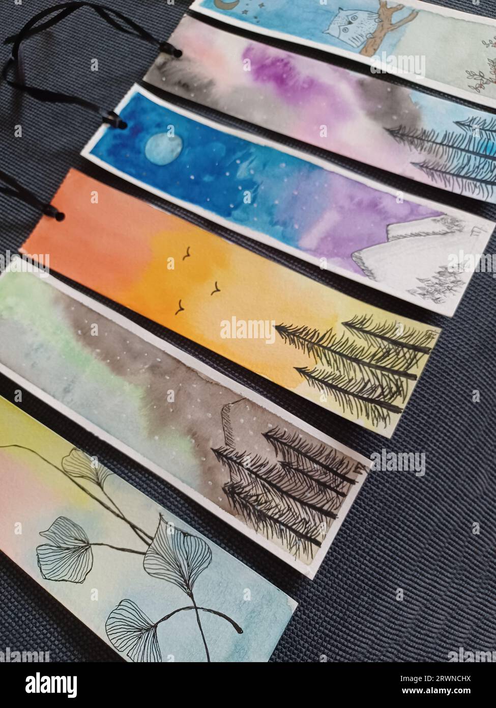 Set of beautiful watercolor bookmarks with ribbons. Black background ...