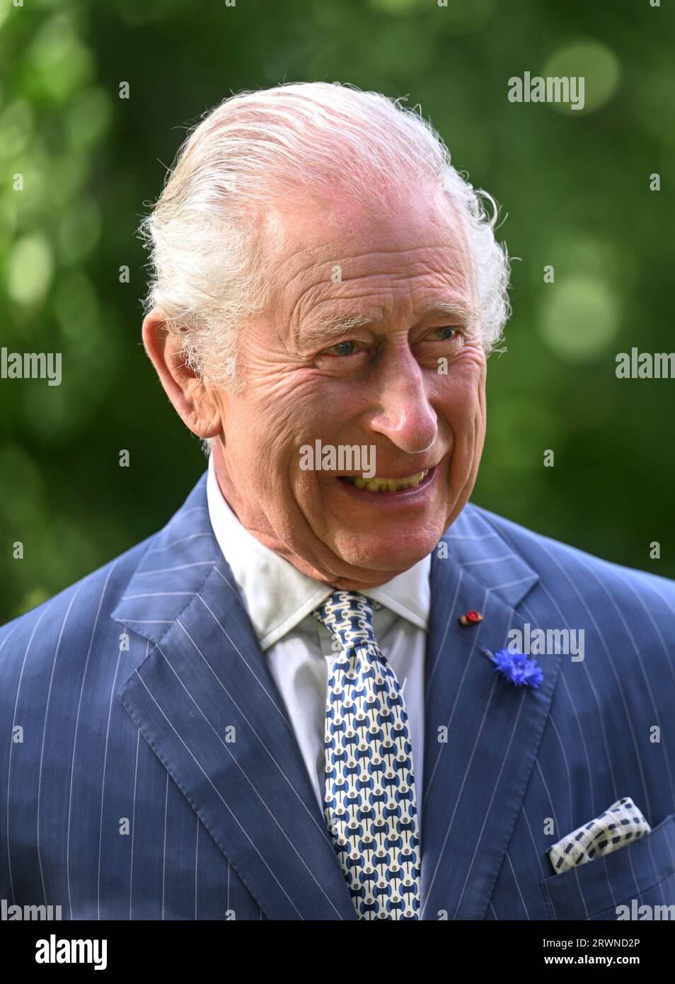 King Charles III before planting a tree in the garden of the British ...