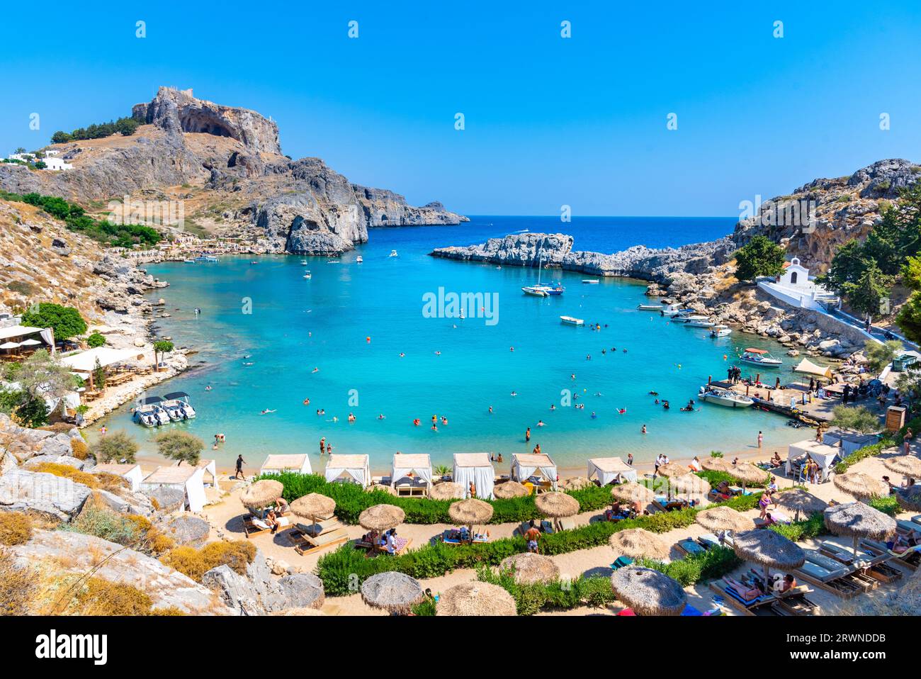 Panoramic view of St. Paul bay with acropolis of Lindos in background ...