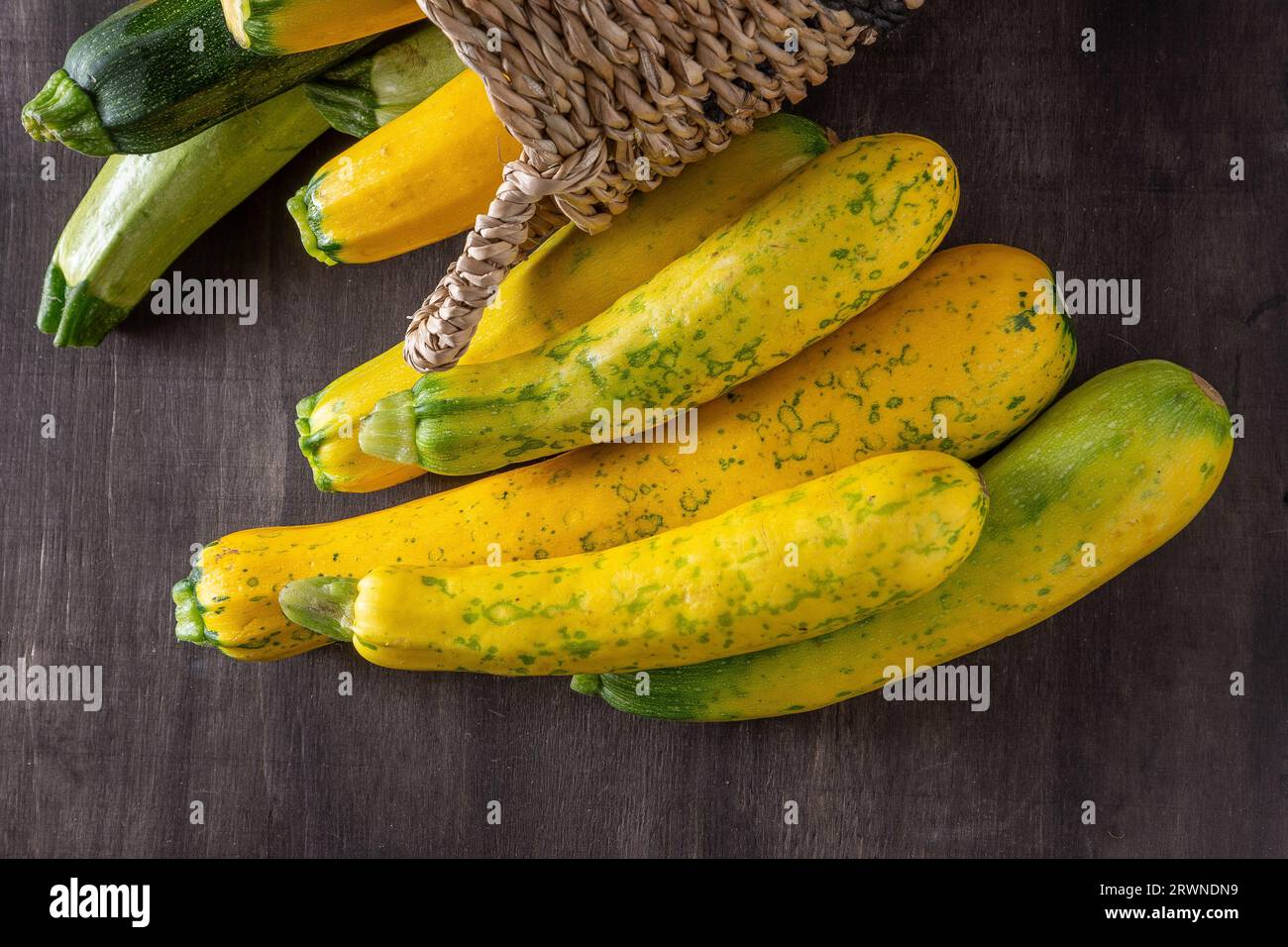 Yellow green leopard spotted zucchini. Vegetables on the table ...