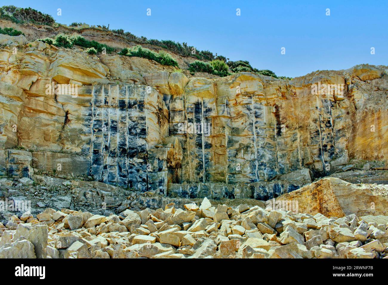Hopeman Moray Coast Scotland the rock face and piles of broken ...