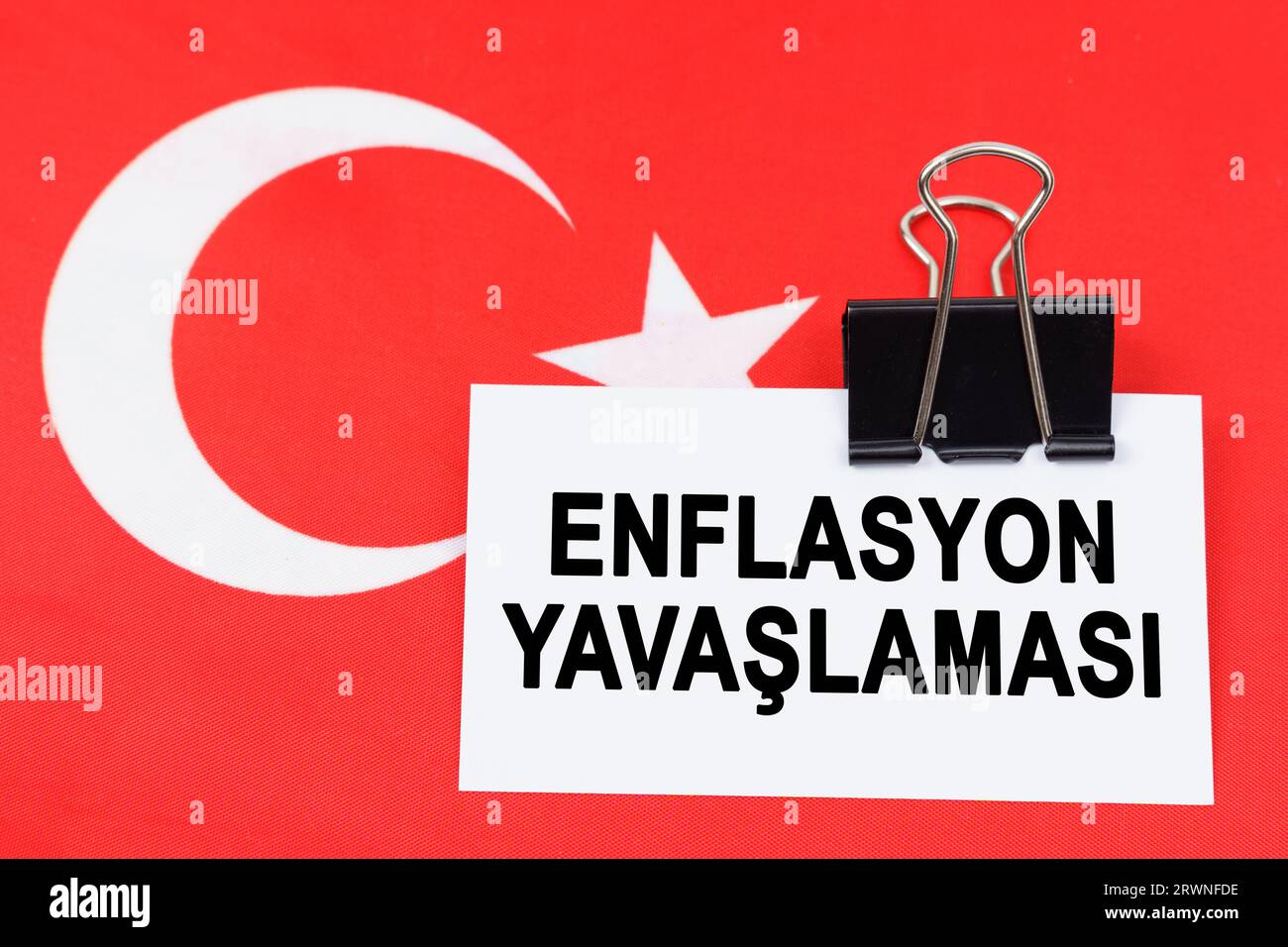 Economy and finance concept. On the flag of Turkey lies a business card ...