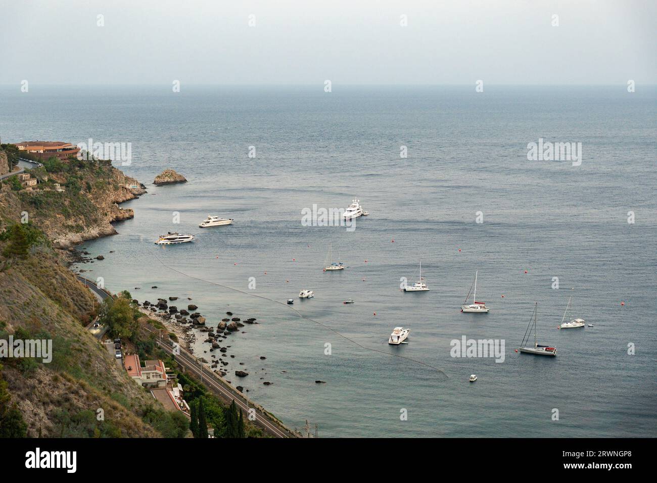 View from top to the Sea and cliffs with train station down the hill in ...