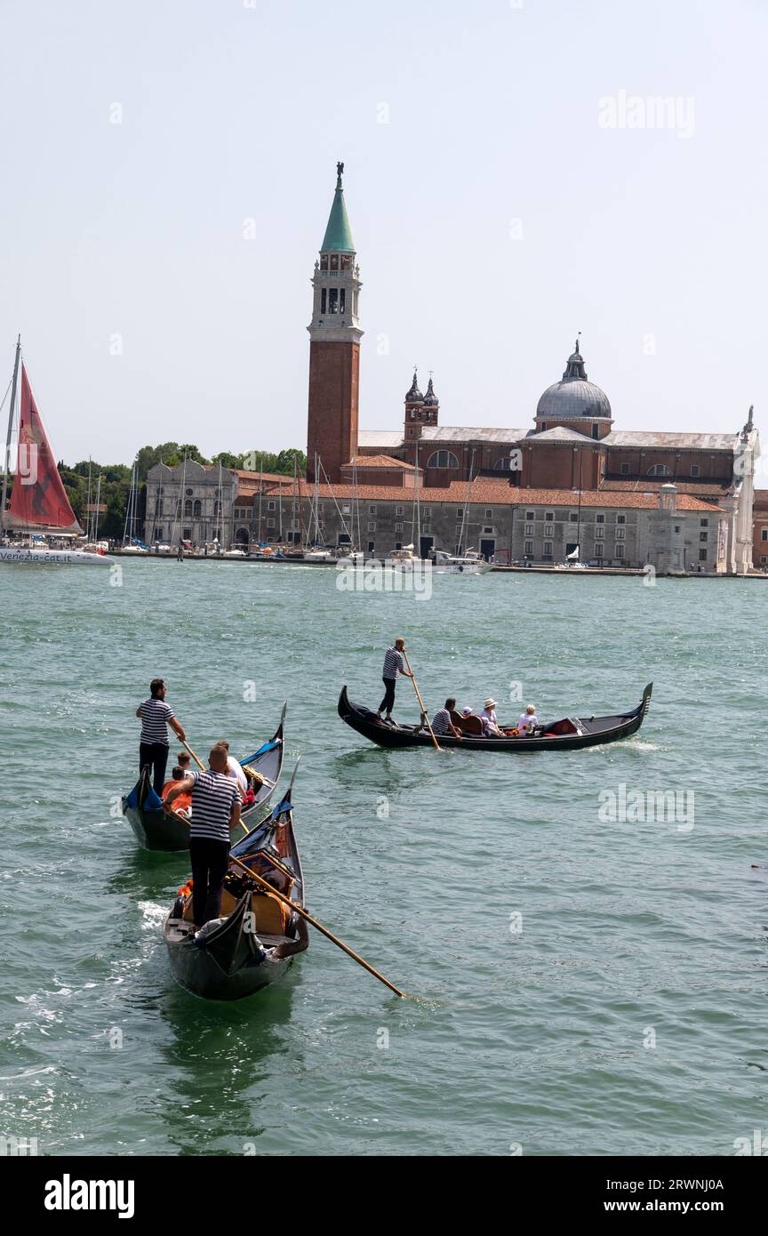 Three gondolas in line, head out into the Lagoon opposite the 63 metres ...