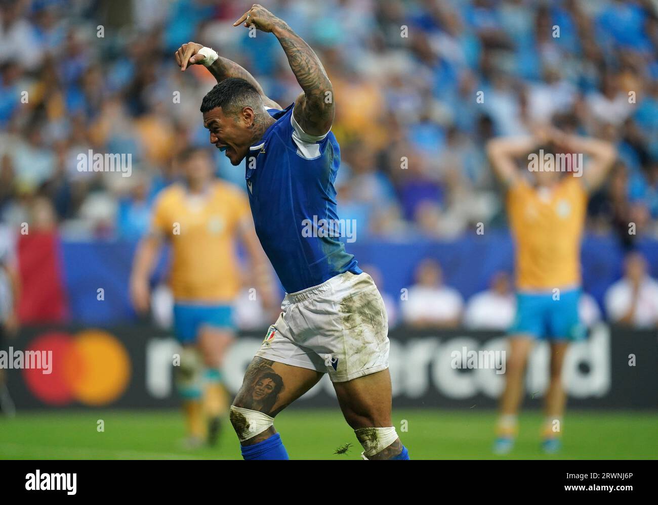 Italy's Monty Ioane celebrates scoring their third try during the Rugby ...