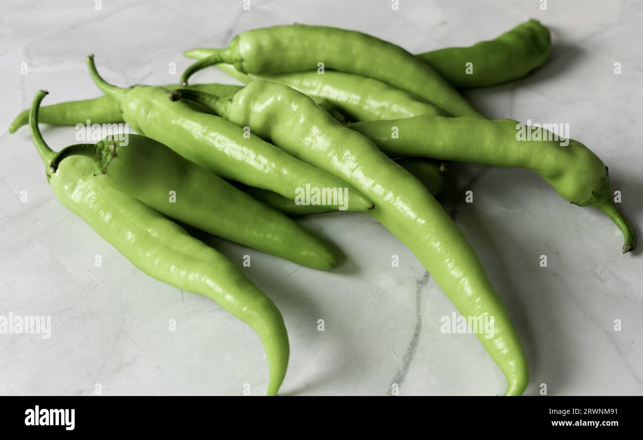 A bunch of green pepper pods. Hot chili pepper Stock Photo - Alamy