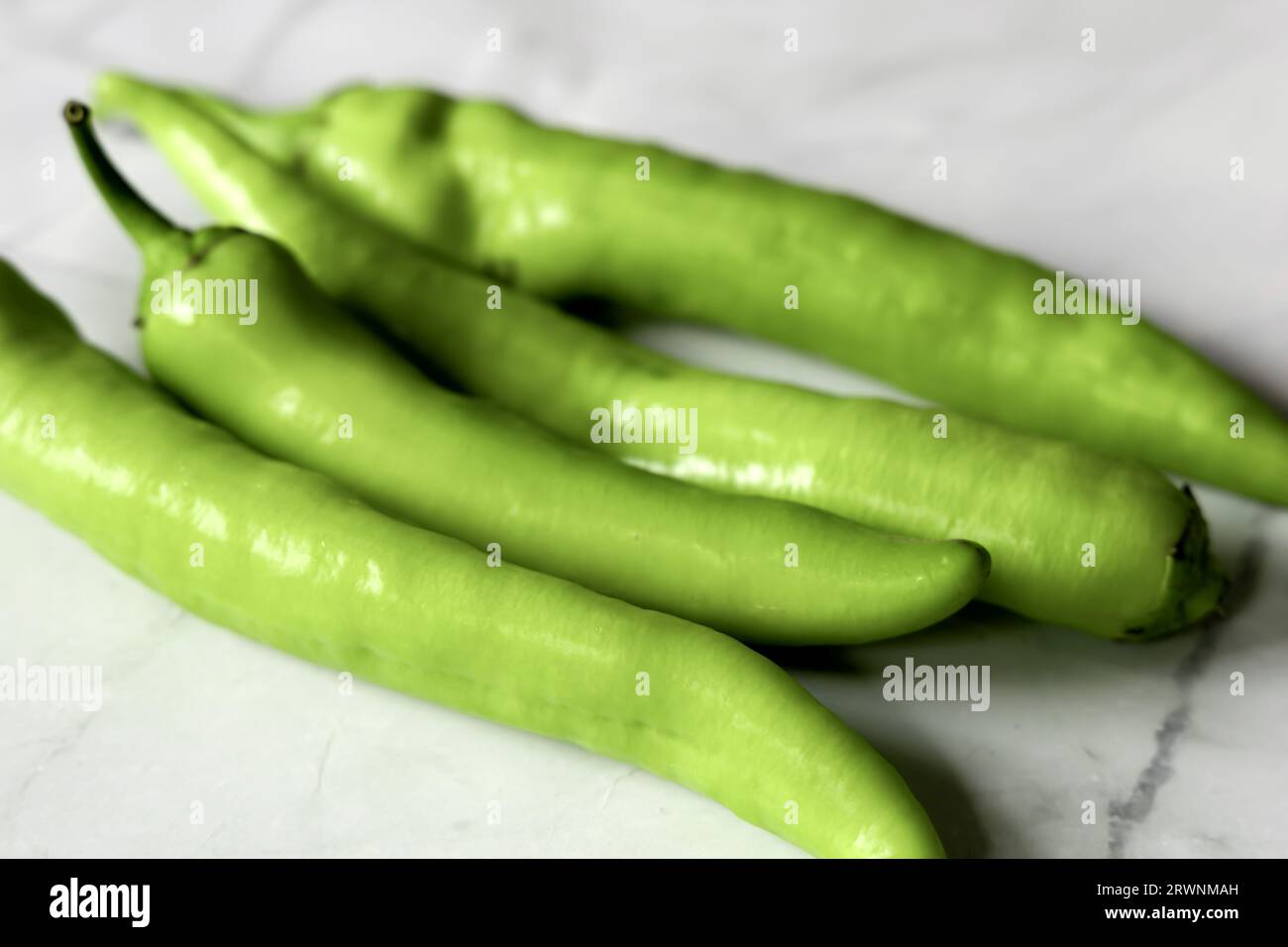 A bunch of green pepper pods. Hot chili pepper Stock Photo - Alamy